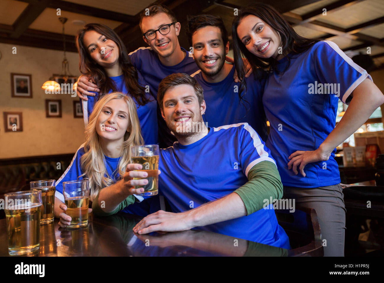football fans or friends with beer at sport bar Stock Photo - Alamy