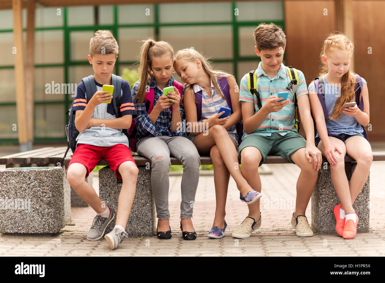 elementary school students with smartphones Stock Photo - Alamy