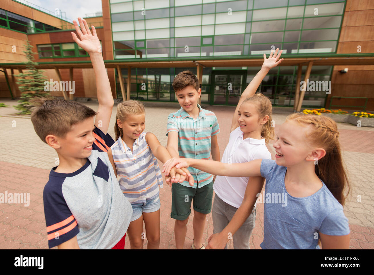 group of happy elementary school students Stock Photo - Alamy