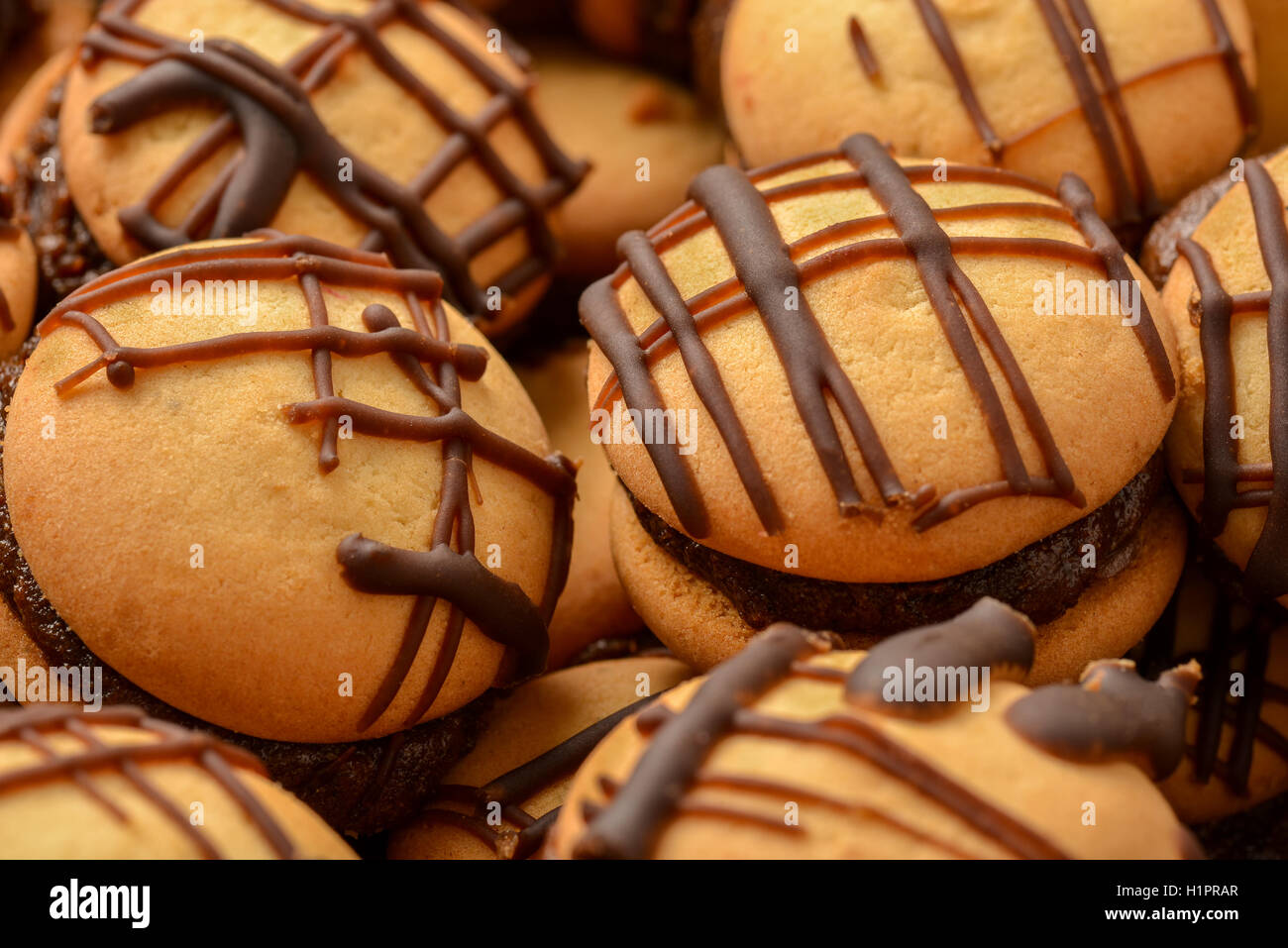 A lot of chocolate cookies with backlight Stock Photo - Alamy