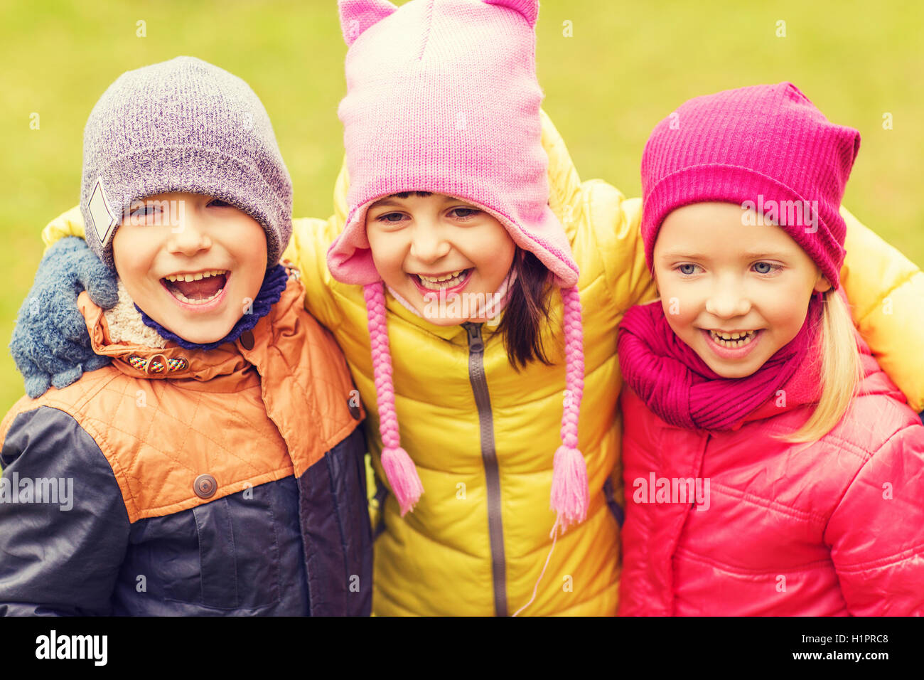 group of happy children hugging in autumn park Stock Photo - Alamy