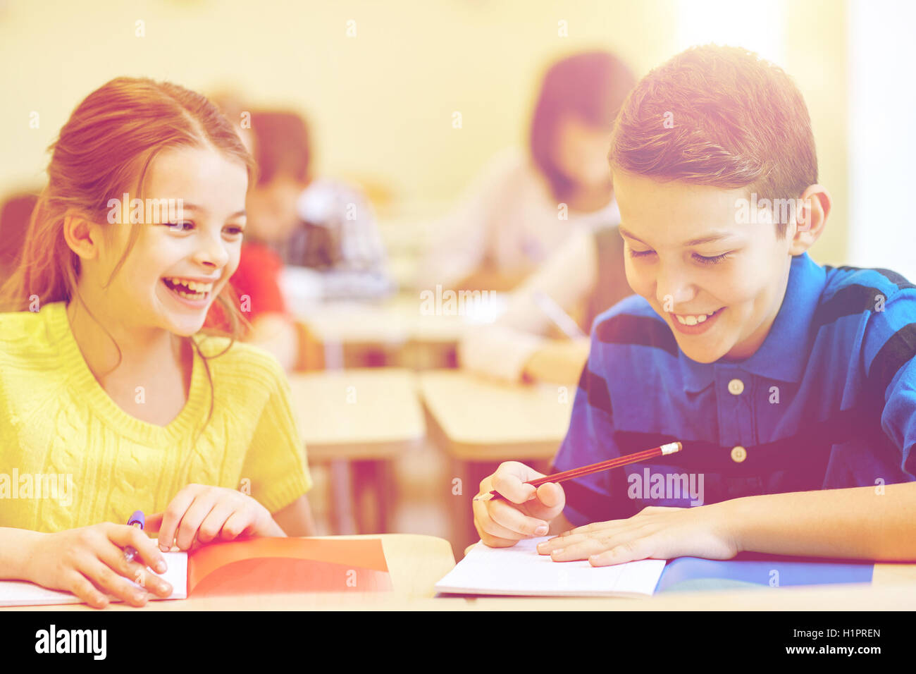 group of school kids writing test in classroom Stock Photo - Alamy