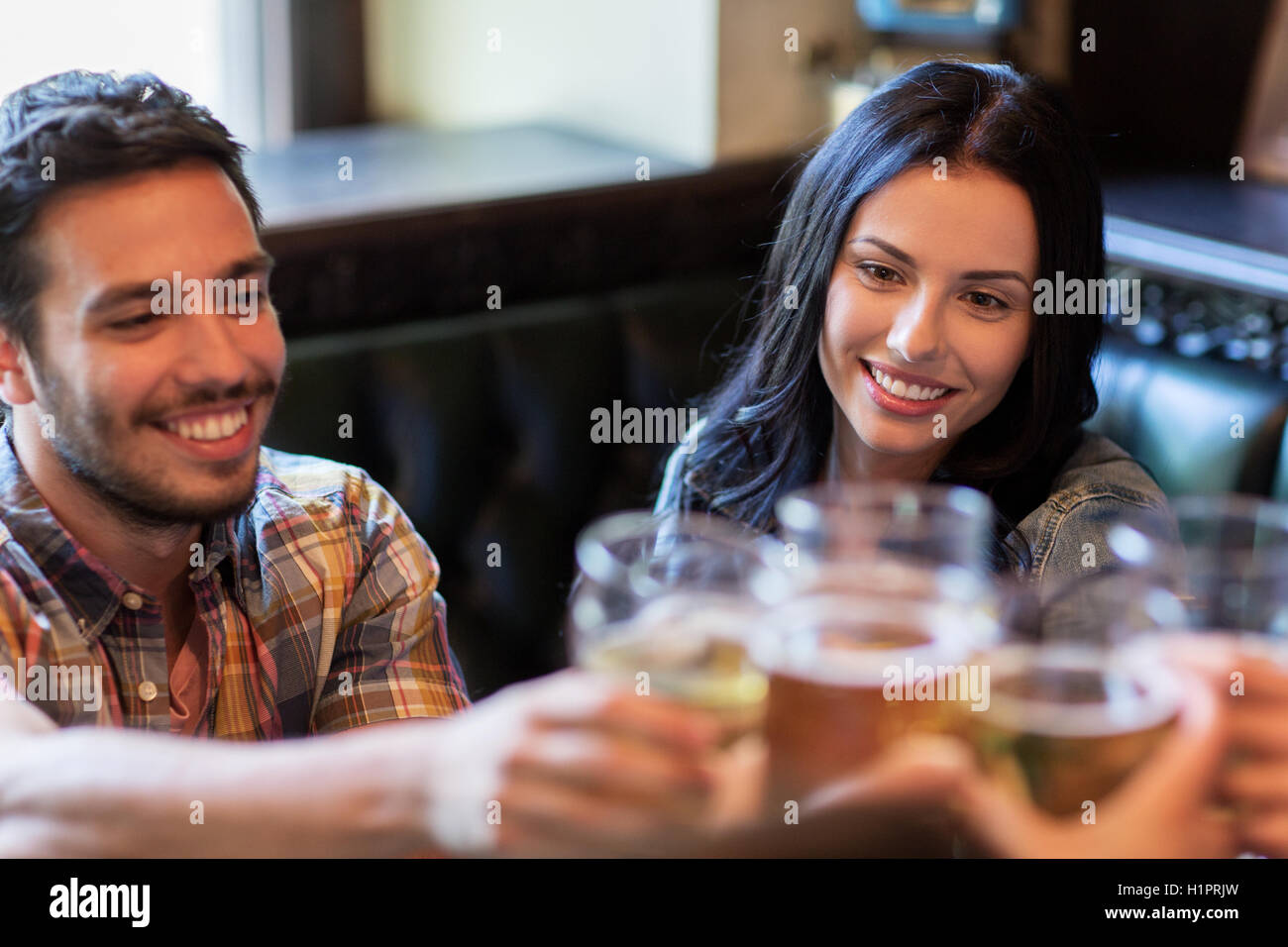 happy friends drinking beer at bar or pub Stock Photo - Alamy