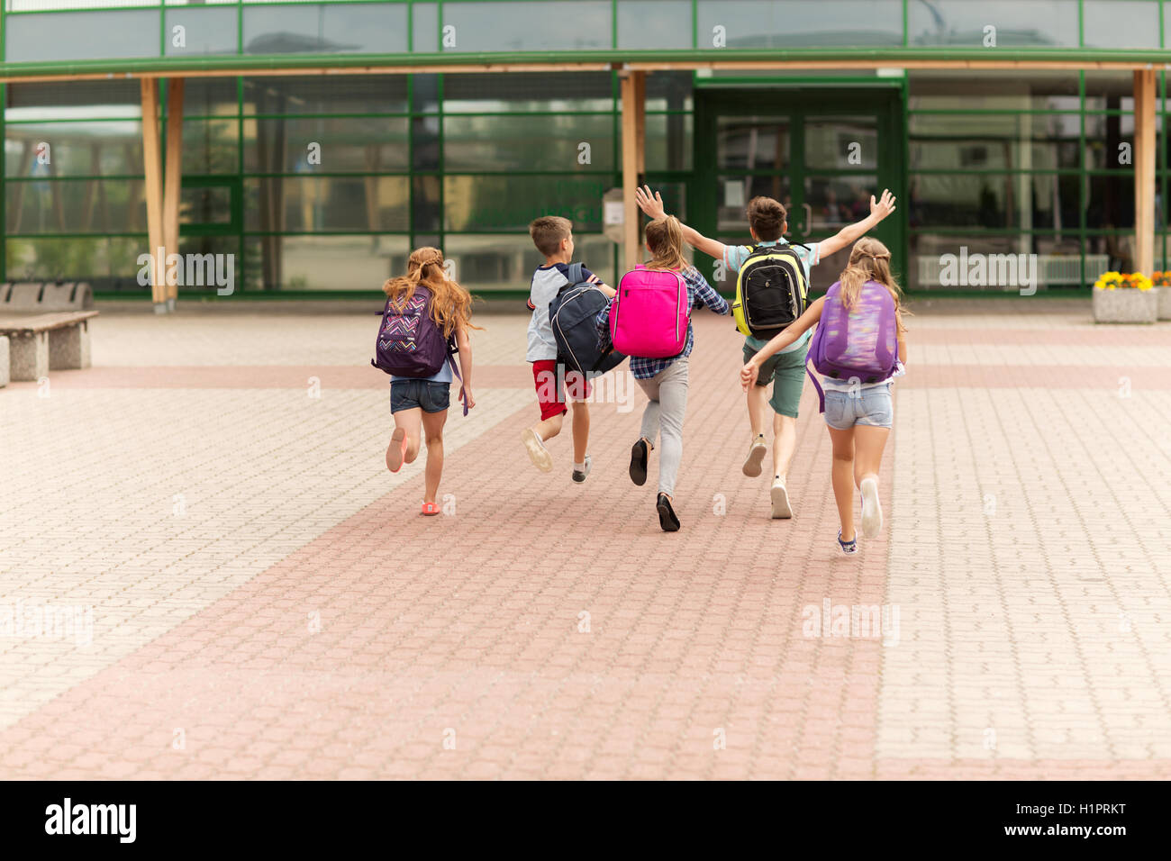 group of happy elementary school students running Stock Photo - Alamy