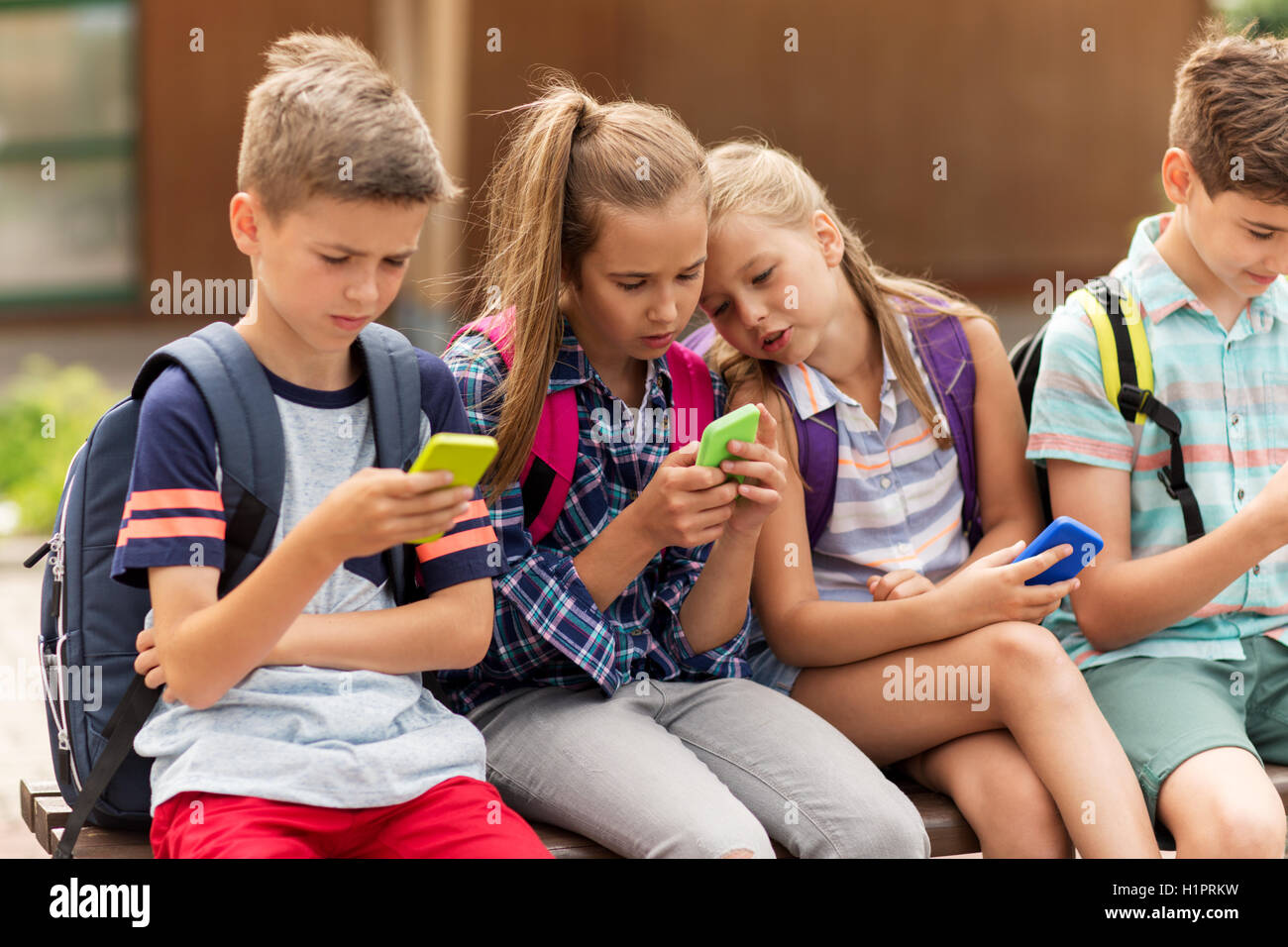 elementary school students with smartphones Stock Photo - Alamy