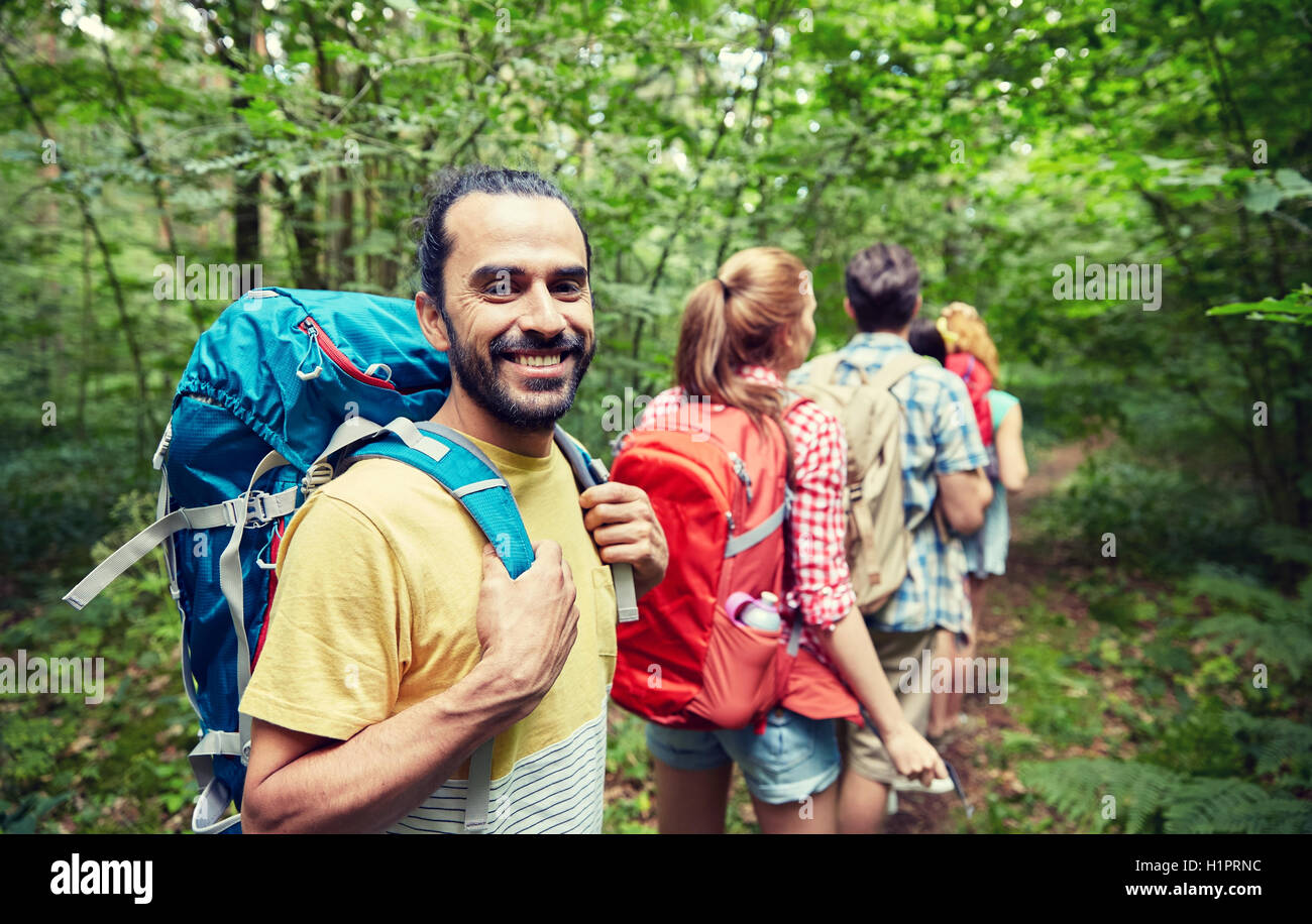 group of smiling friends with backpacks hiking Stock Photo - Alamy