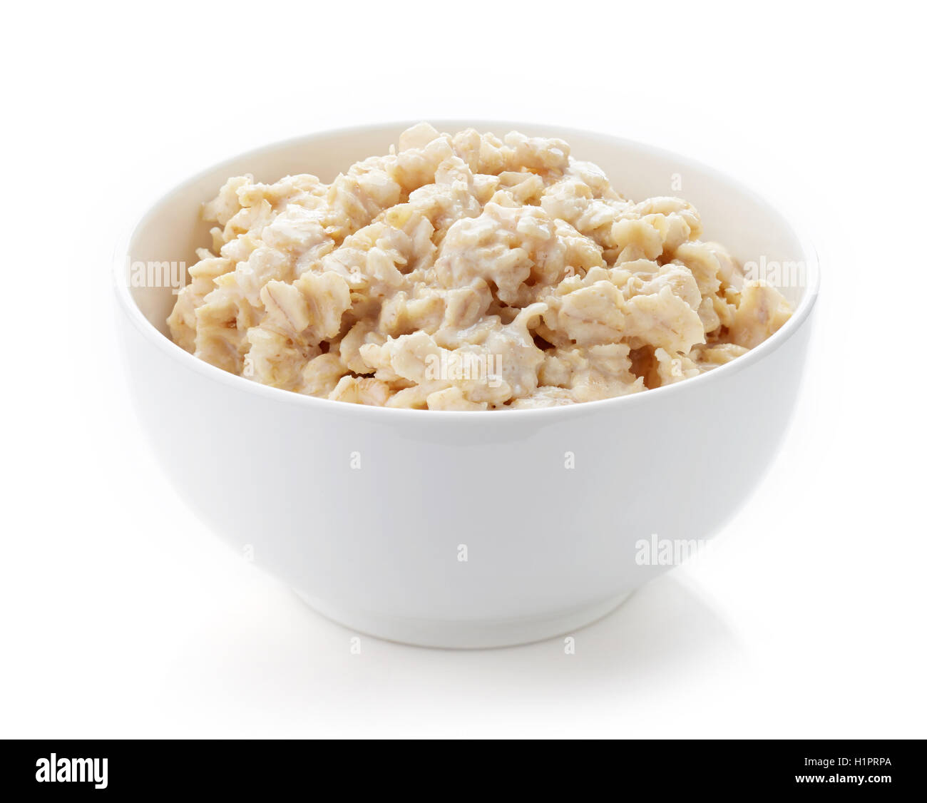 Bowl of healthy oatmeal isolated on white background Stock Photo - Alamy