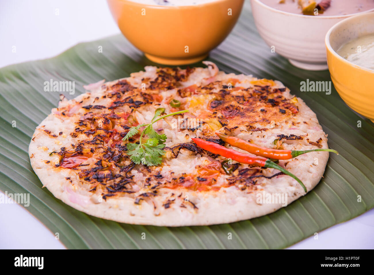 South Indian Food Uttapam or ooththappam or Uthappa is a dosa-like dish ...