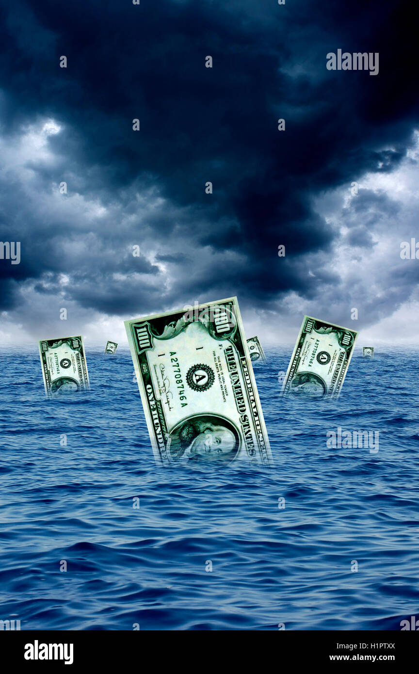 dollar banknotes sinking into ocean Stock Photo - Alamy