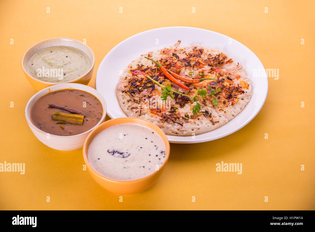 South Indian Food Uttapam or ooththappam or Uthappa is a dosa-like dish ...