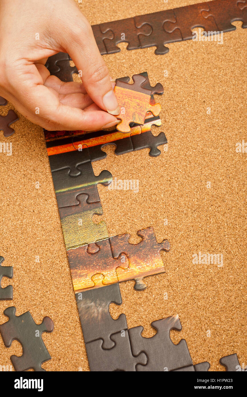 Assembling hand hi-res stock photography and images - Alamy