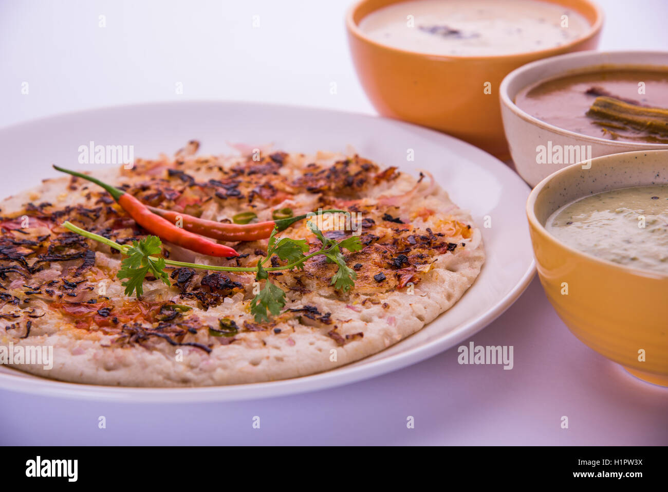 South Indian Food Uttapam or ooththappam or Uthappa is a dosa-like dish ...