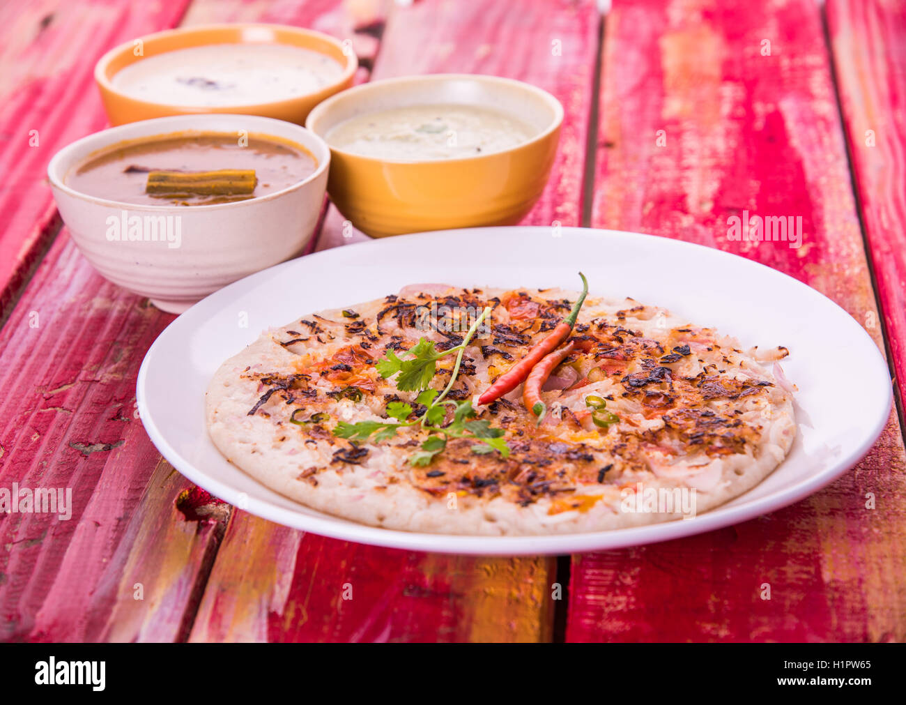 South Indian Food Uttapam or ooththappam or Uthappa is a dosa-like dish ...