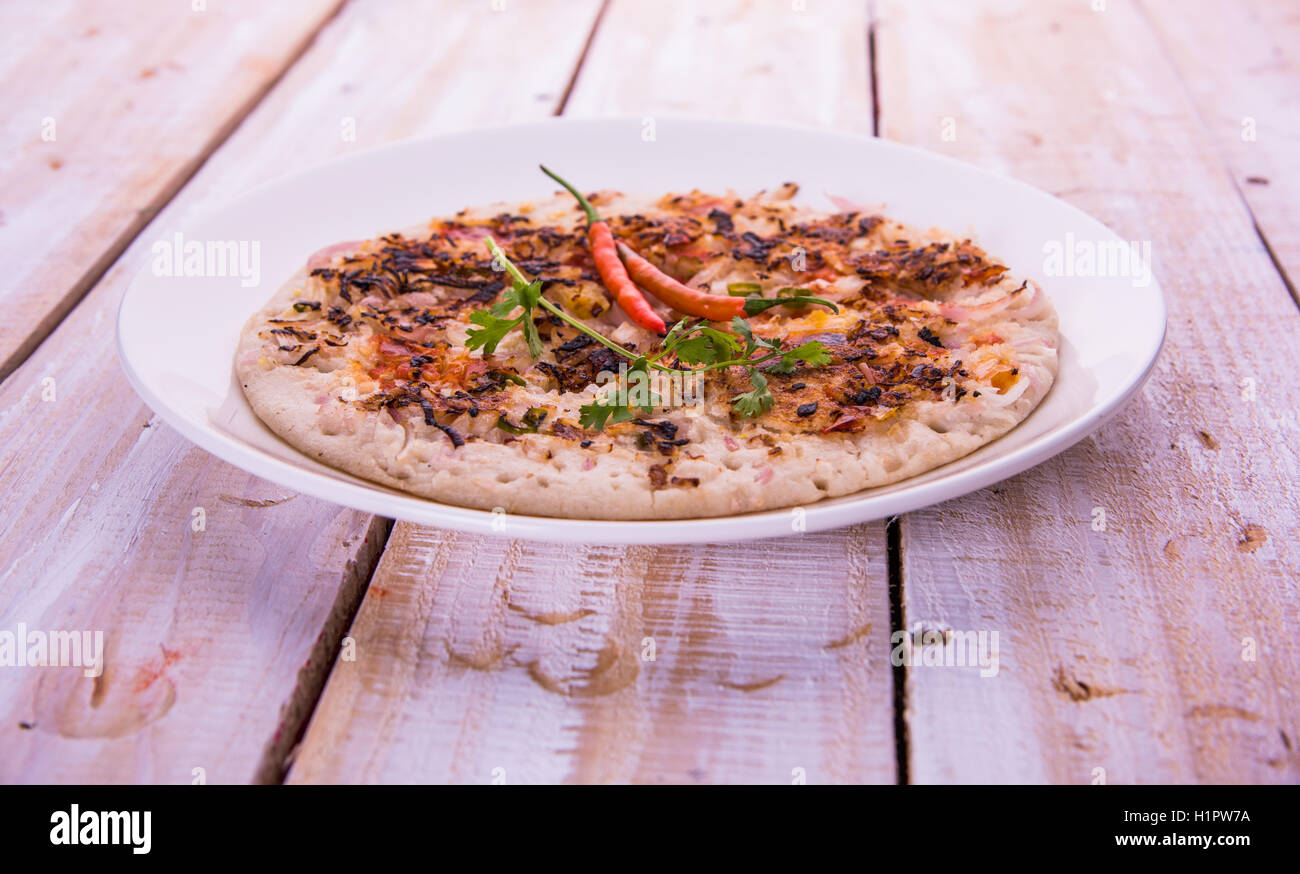 South Indian Food Uttapam or ooththappam or Uthappa is a dosa-like dish ...