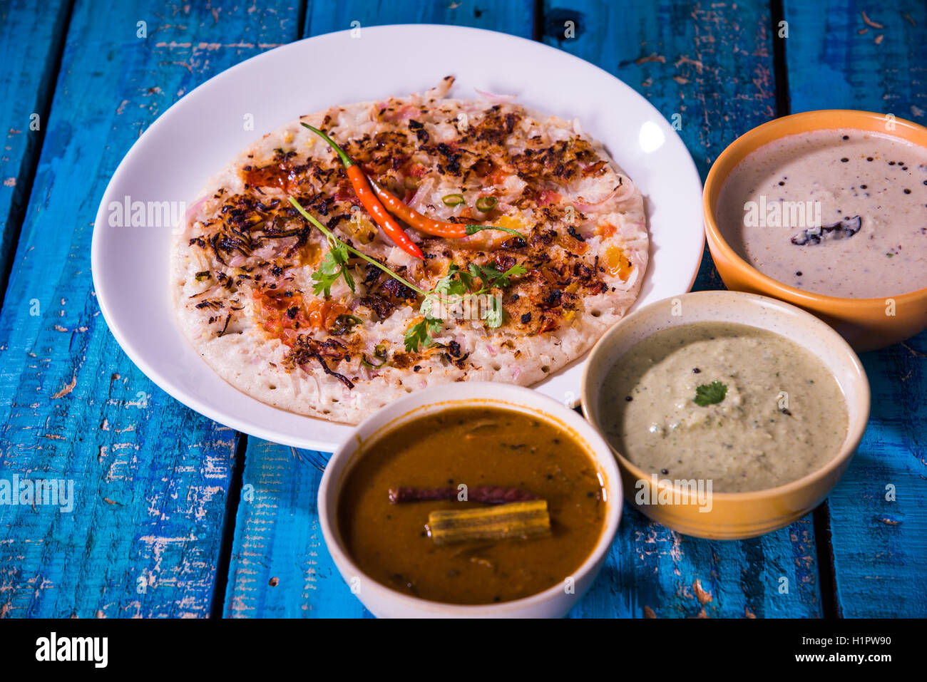 South Indian Food Uttapam or ooththappam or Uthappa is a dosa-like dish ...