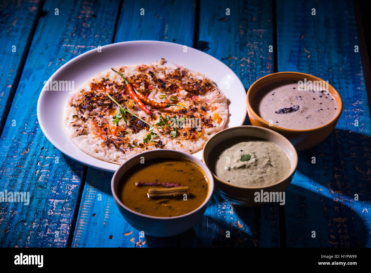 South Indian Food Uttapam or ooththappam or Uthappa is a dosa-like dish ...