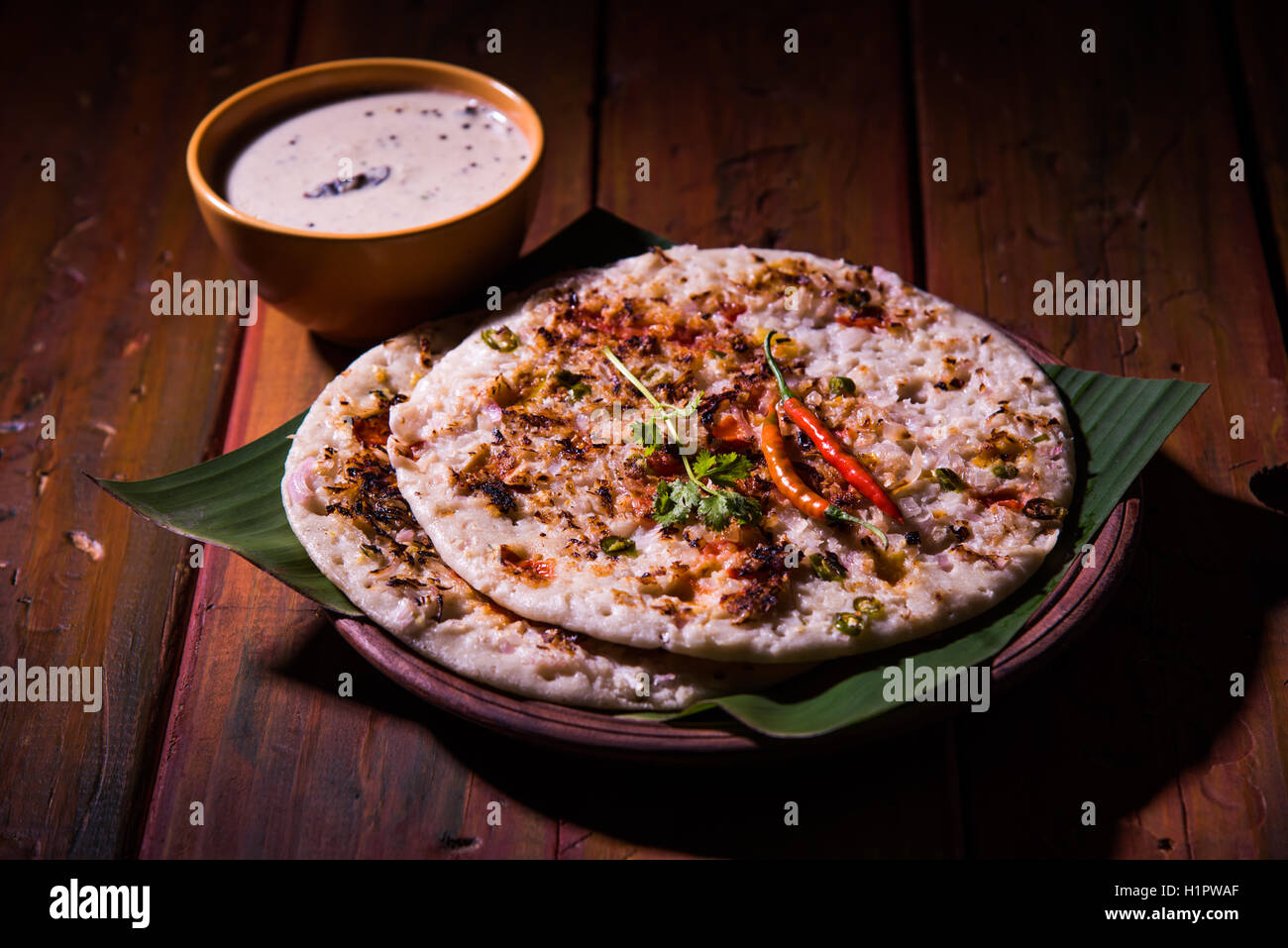 South Indian Food Uttapam or ooththappam or Uthappa is a dosa-like dish ...