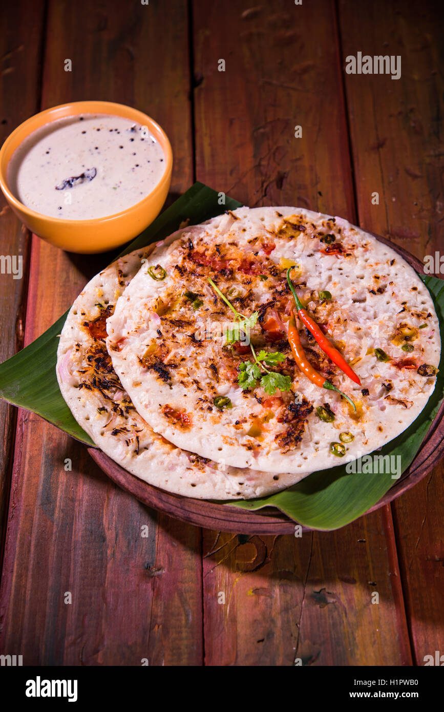 South Indian Food Uttapam or ooththappam or Uthappa is a dosa-like dish ...