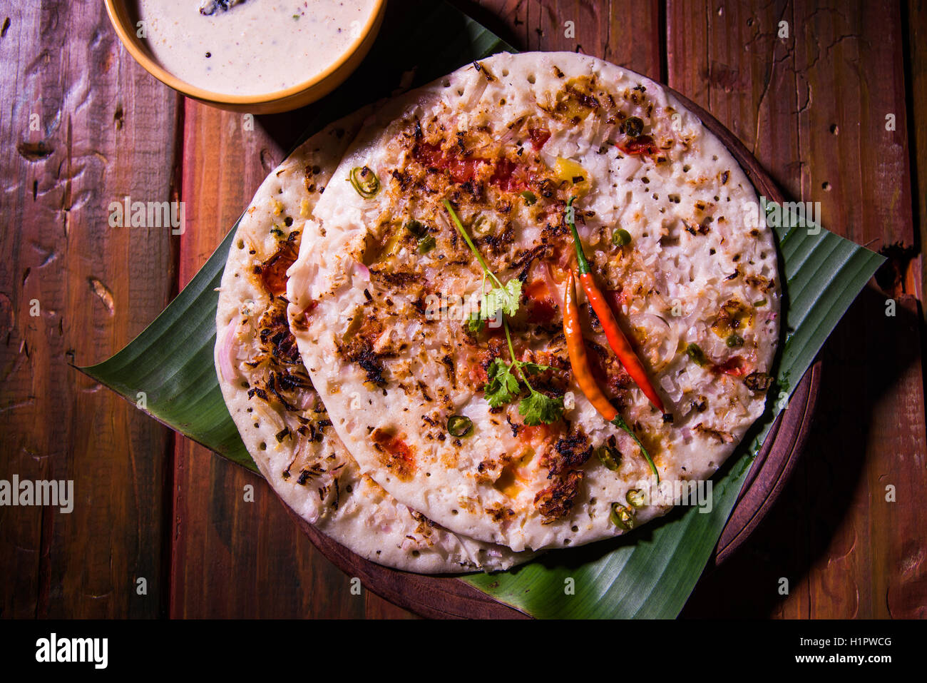 South Indian Food Uttapam or ooththappam or Uthappa is a dosa-like dish ...