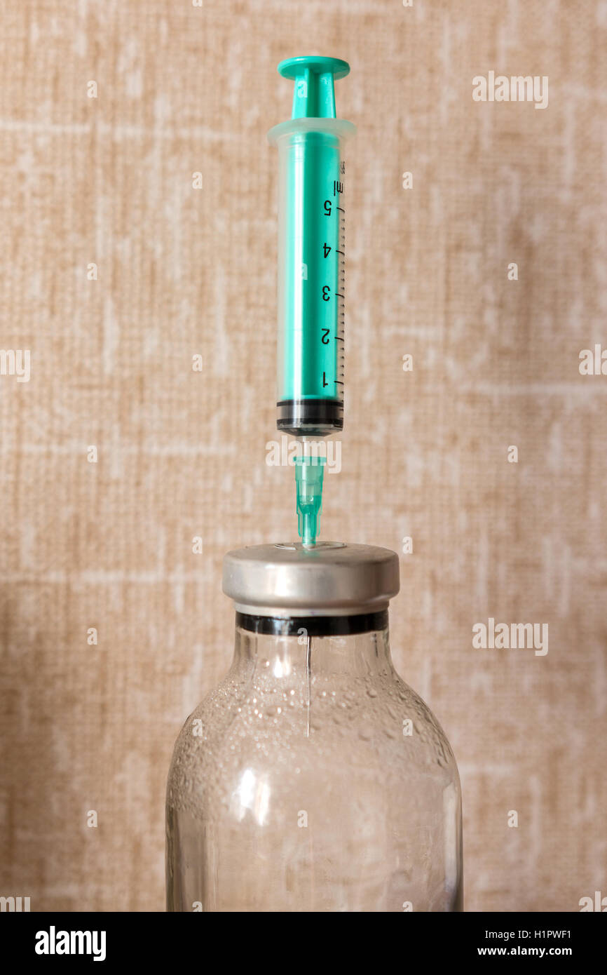 Plastic syringe stuck bottle hi-res stock photography and images - Alamy