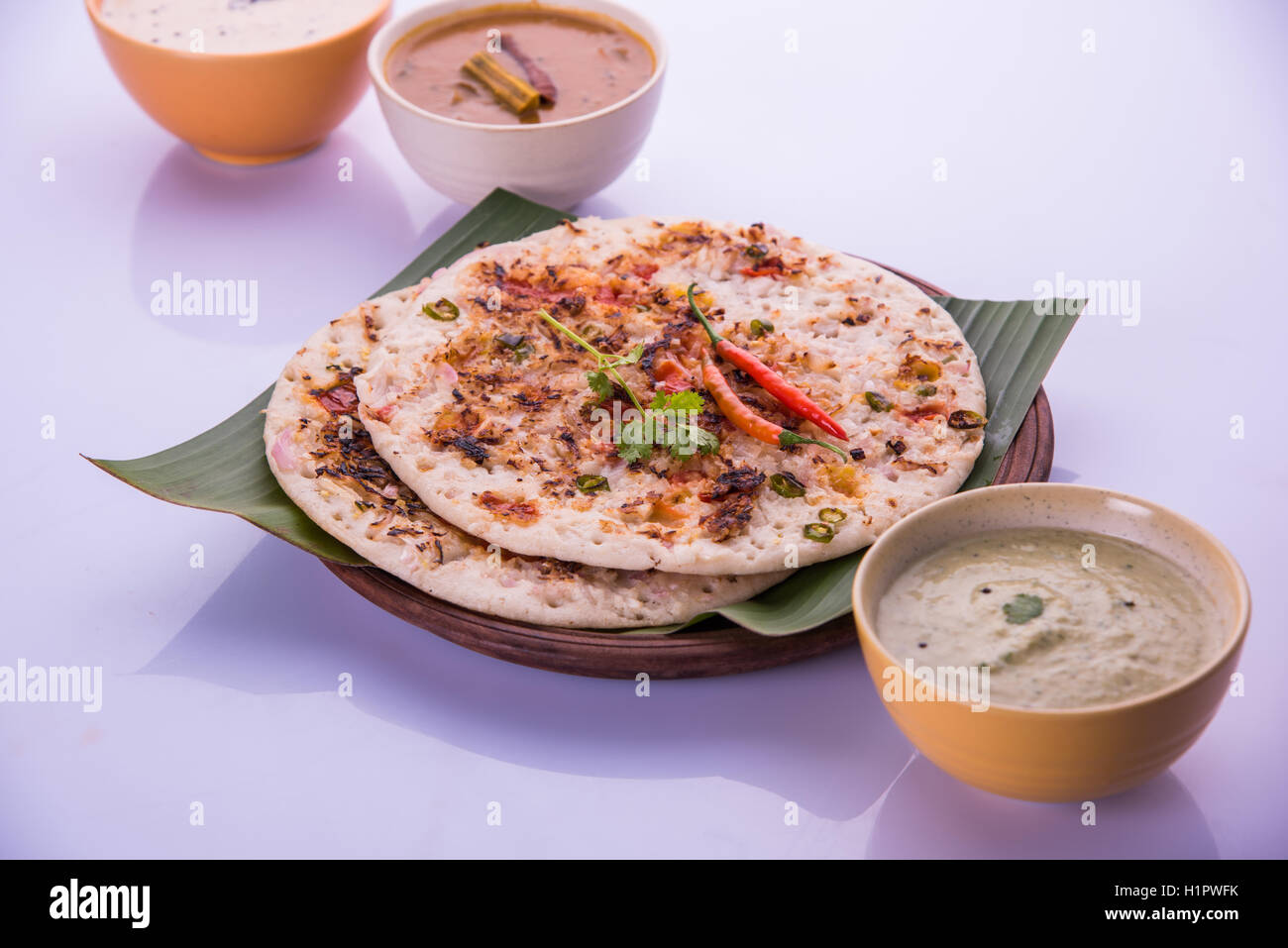 South Indian Food Uttapam or ooththappam or Uthappa is a dosa-like dish ...