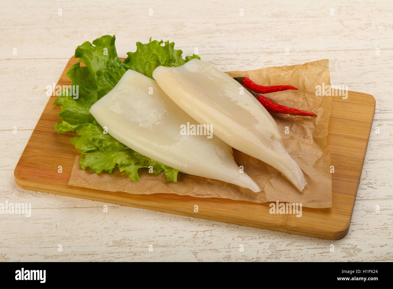 Raw squid fillet ready for cooking Stock Photo - Alamy