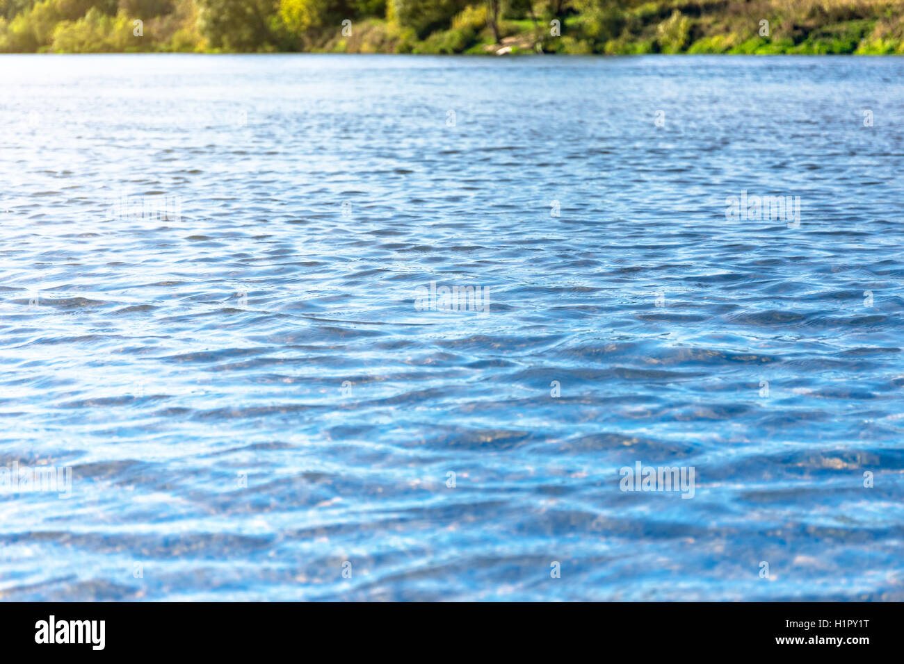 Blue water surface with horizon line Stock Photo - Alamy