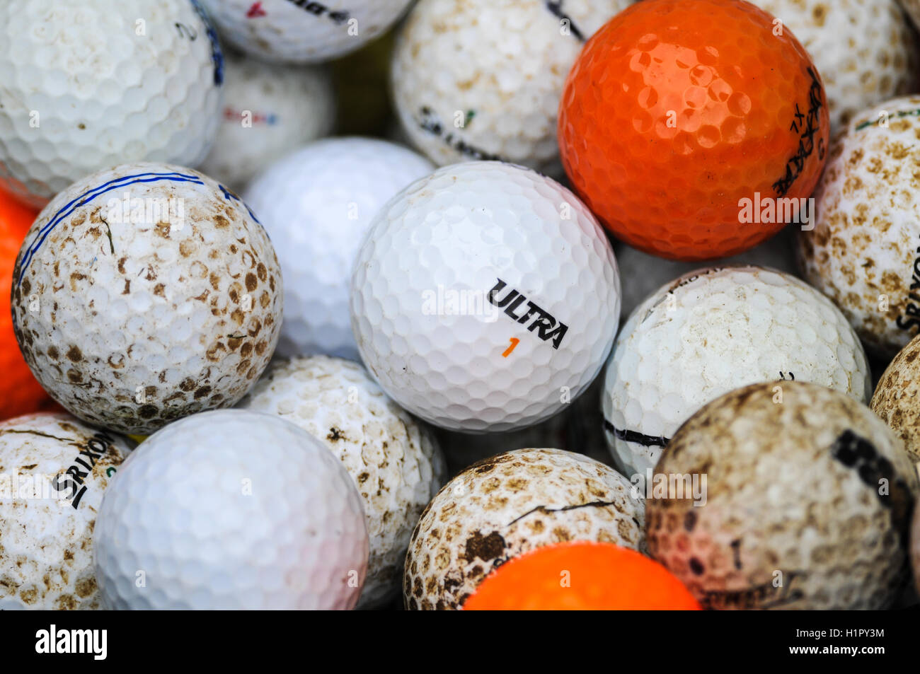Used golf balls Stock Photo - Alamy