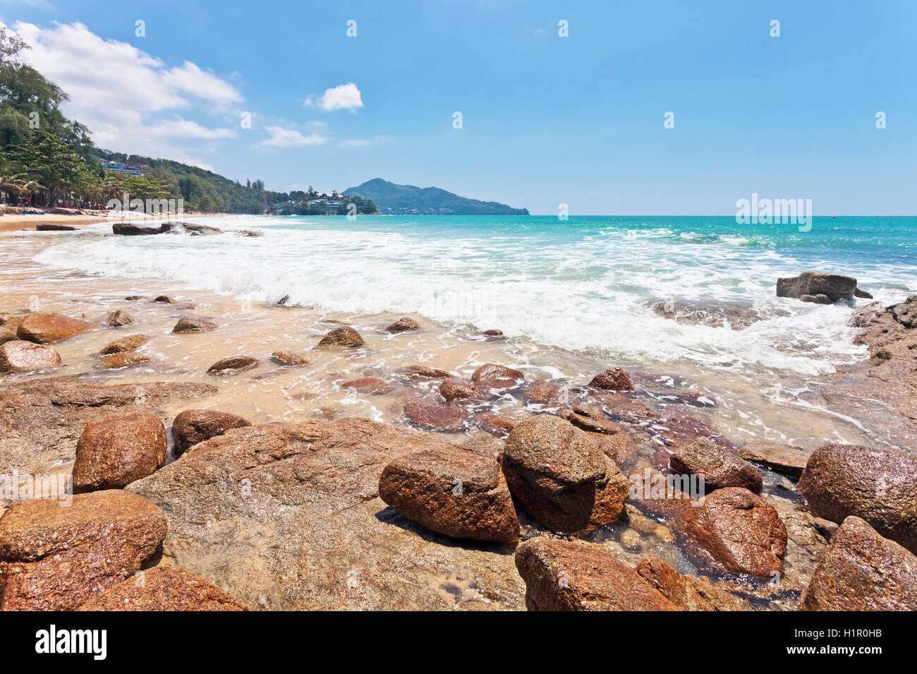 Beautiful tropical beach with stones. Nature background Stock Photo - Alamy