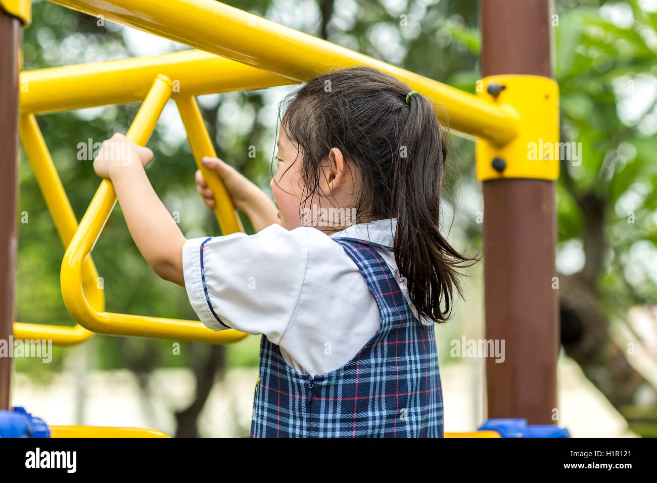 Child hanging bar at playground outdoor or park Stock Photo - Alamy