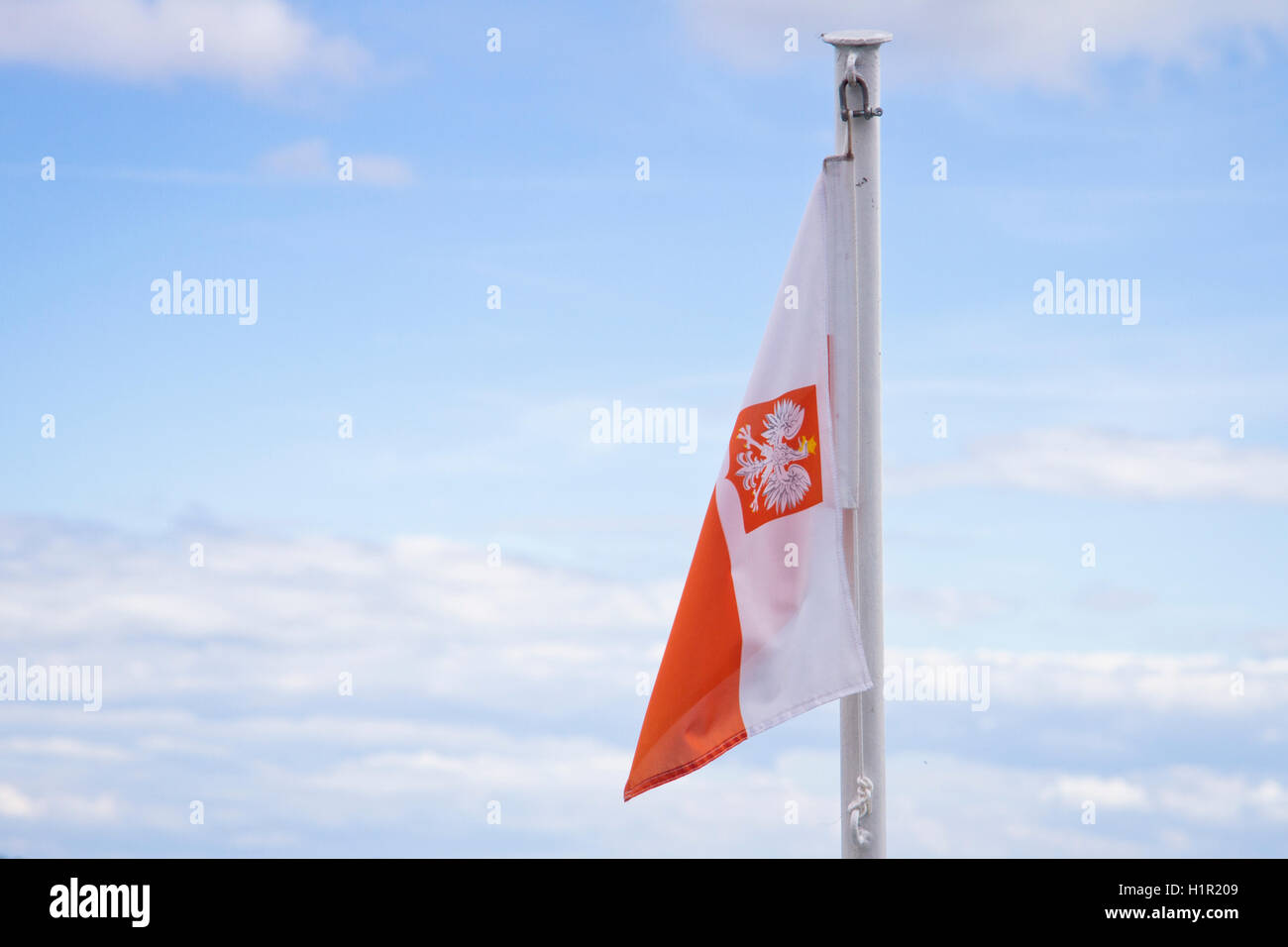 Polish flag at the top of the yacht mast Stock Photo - Alamy