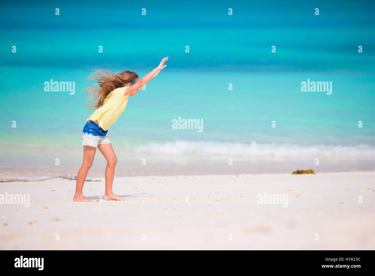 Adorable active little girl at beach during summer vacation Stock Photo ...