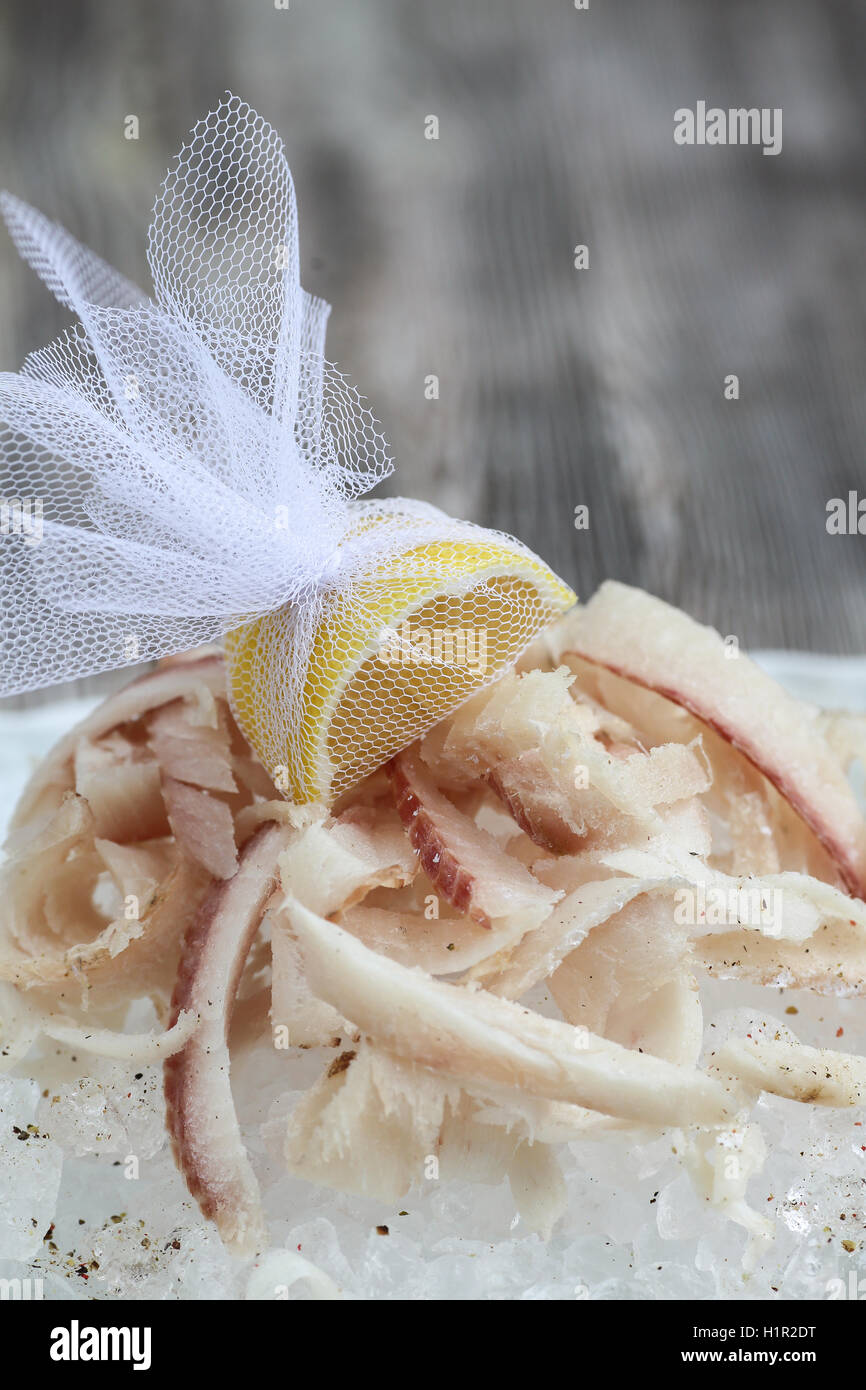 Sliced raw frozen fish with ice Stock Photo - Alamy