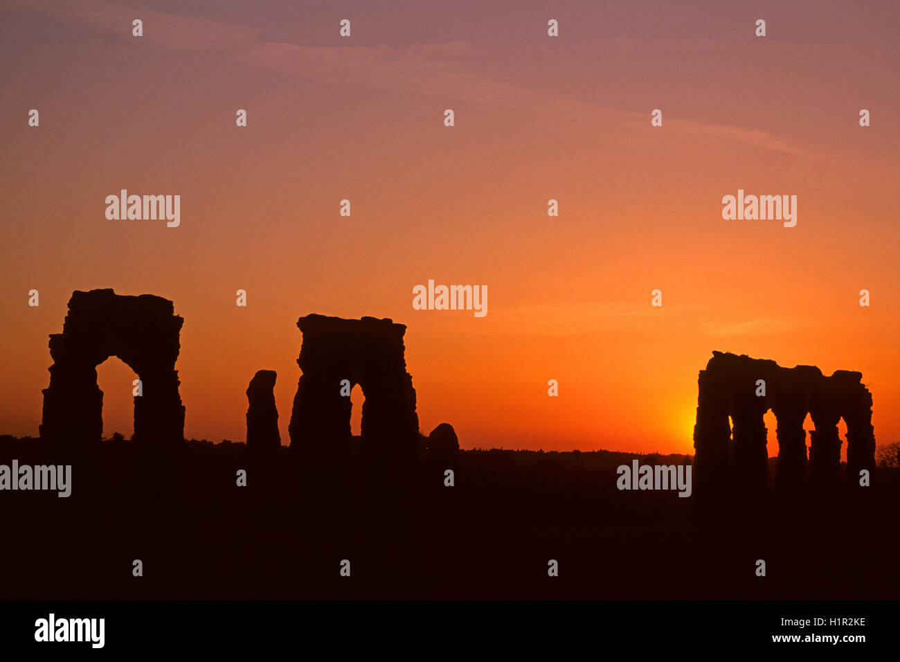 Ruins of Aqueduct Claudio-Anio Novus at dusk, Park of the Aqueducts ...