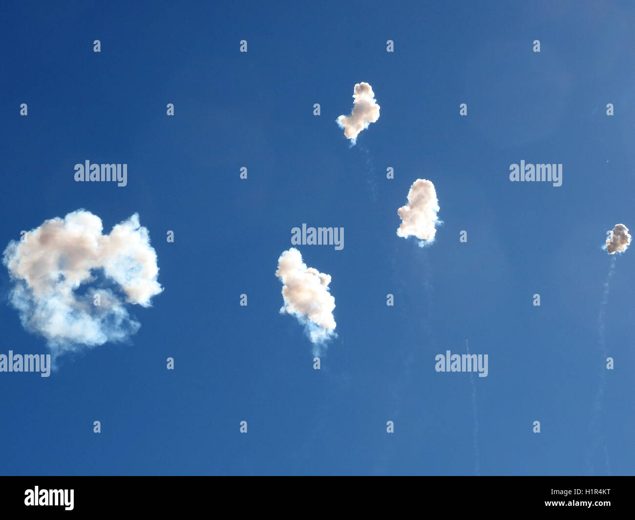 white smoke from exploding fireworks in blue sky above Valencia to ...