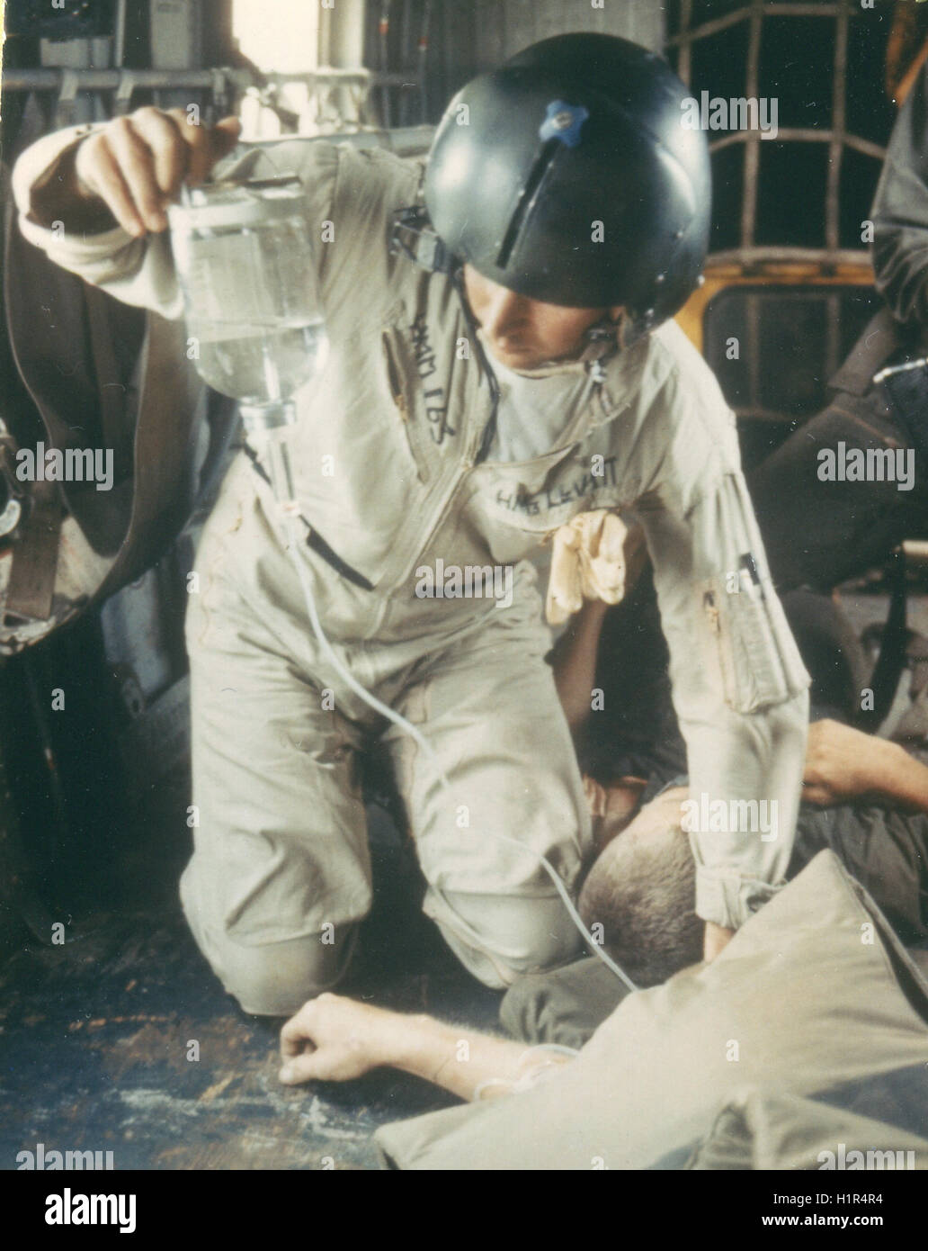 Hospital Corpsman Third Class Ira Levitt administers dextrose to a ...