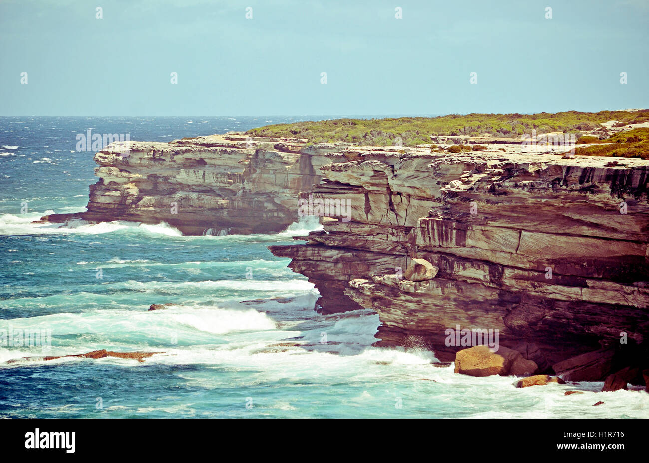 Weathered, rugged sandstone cliffs of Cape Solander, New South Wales ...