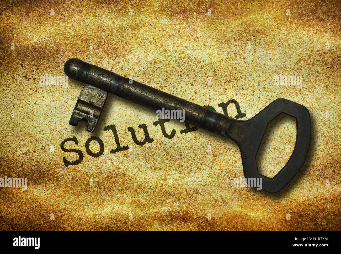 Old key and word Solution written on grunge background Stock Photo - Alamy