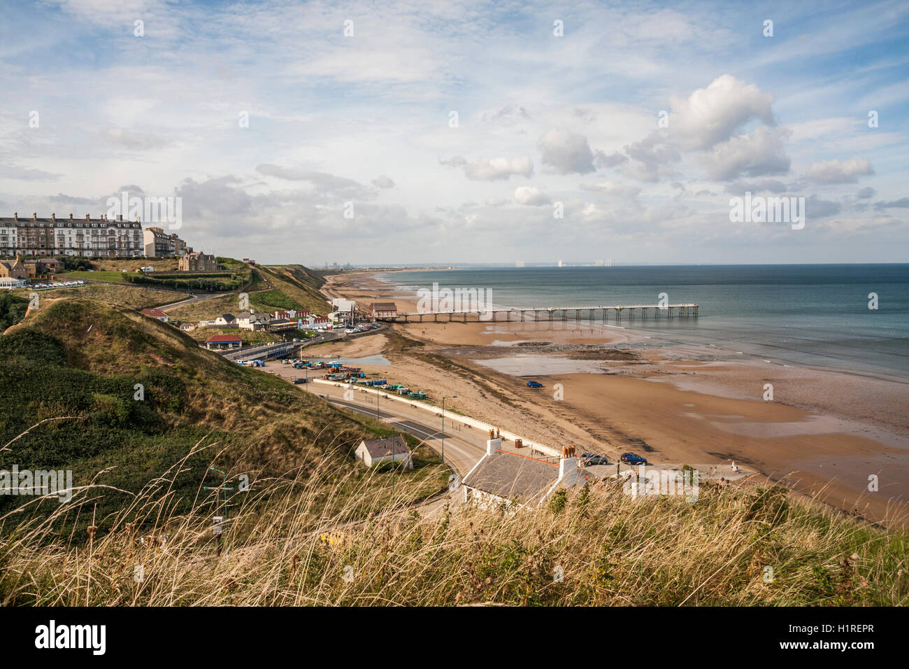 A cliff top view of the beach and pier at Saltburn by the Sea,England ...