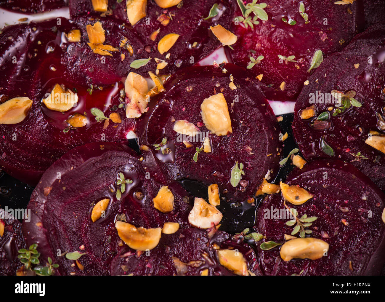 Roasted beet root salad with herbs and hazelnuts Stock Photo - Alamy