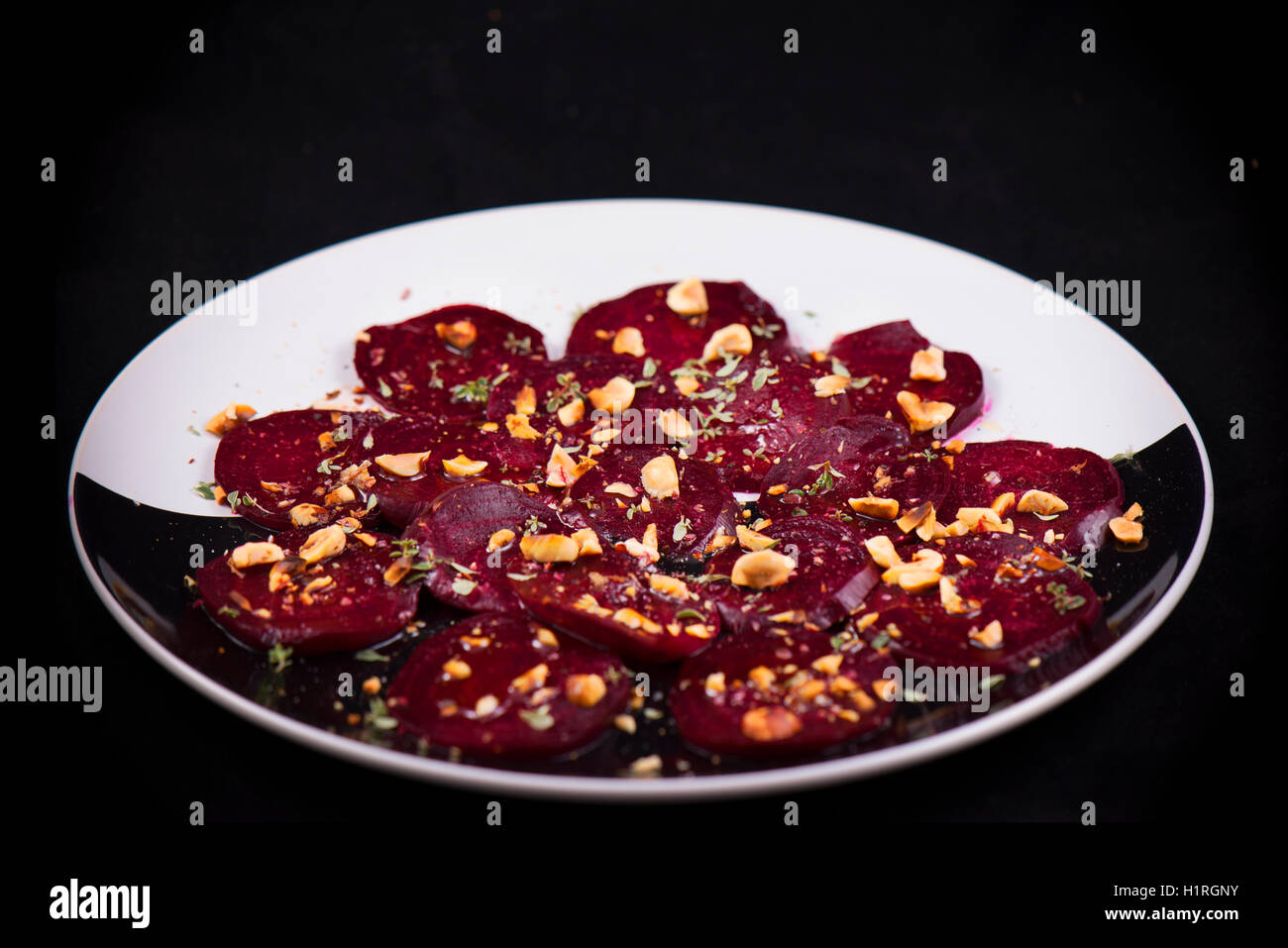 Roasted beet root salad with herbs and hazelnuts Stock Photo - Alamy
