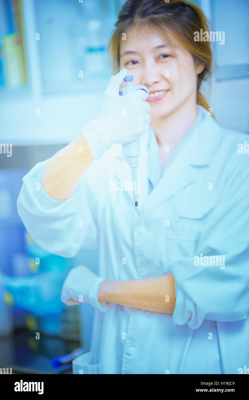 Portrait of happy young science woman standing Stock Photo - Alamy