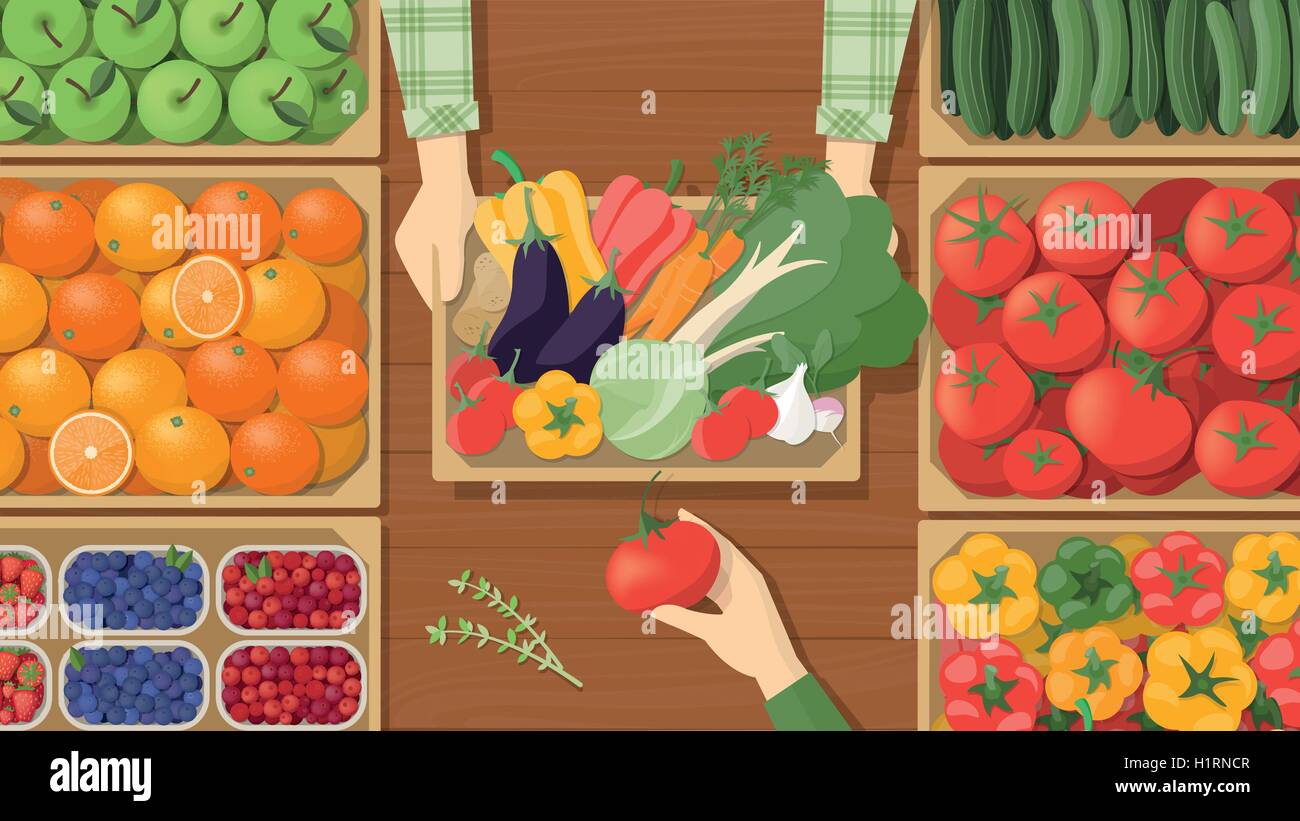 Farmer selling his freshly harvested vegetables at the local market, a ...