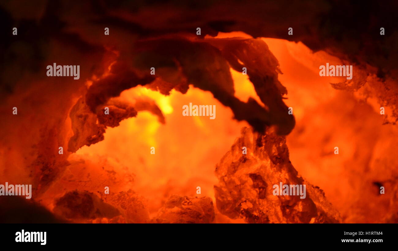 A big burning fire in the fireplace gives off a lot of heat Stock Photo ...