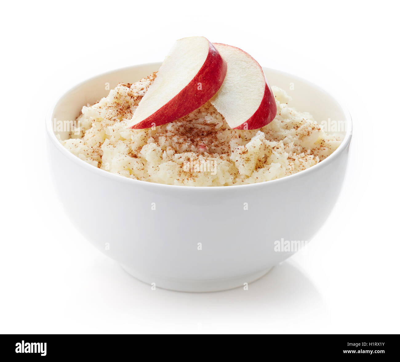 Bowl of rice flakes porridge with apple slices and cinamon isolated on ...