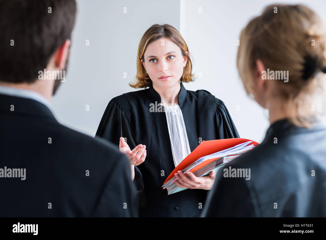 Couple with a lawyer Stock Photo - Alamy
