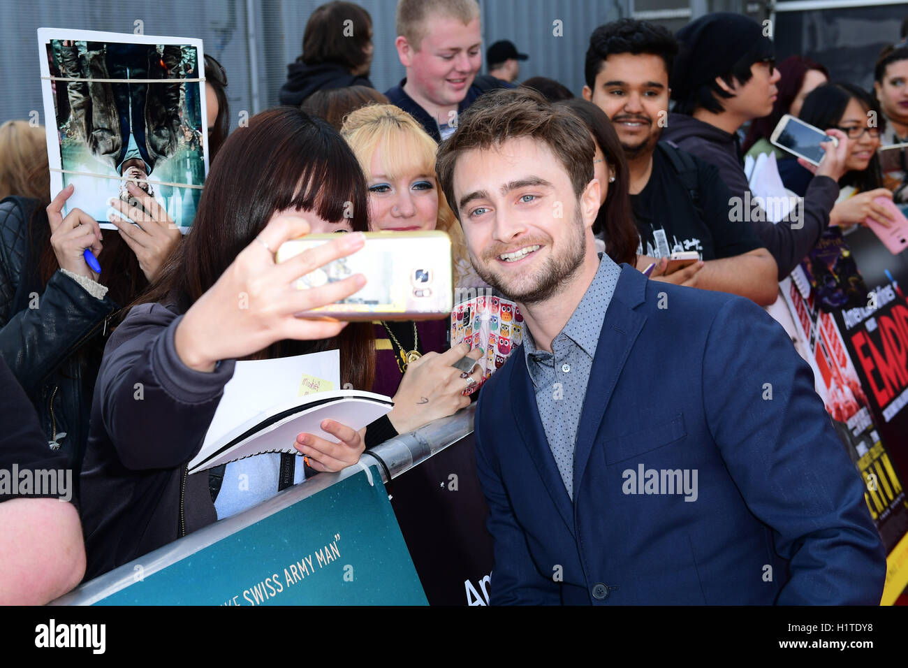 Daniel Radcliffe poses for a selfie with fans as he attends a screening ...