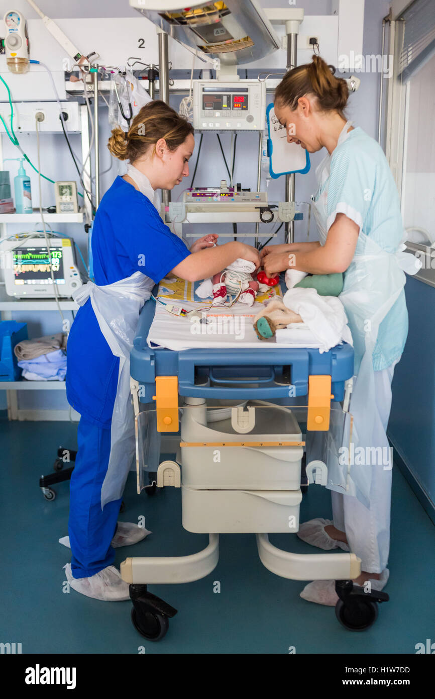 Pediatric nurses and a premature newborn baby, CHU Bordeaux France ...