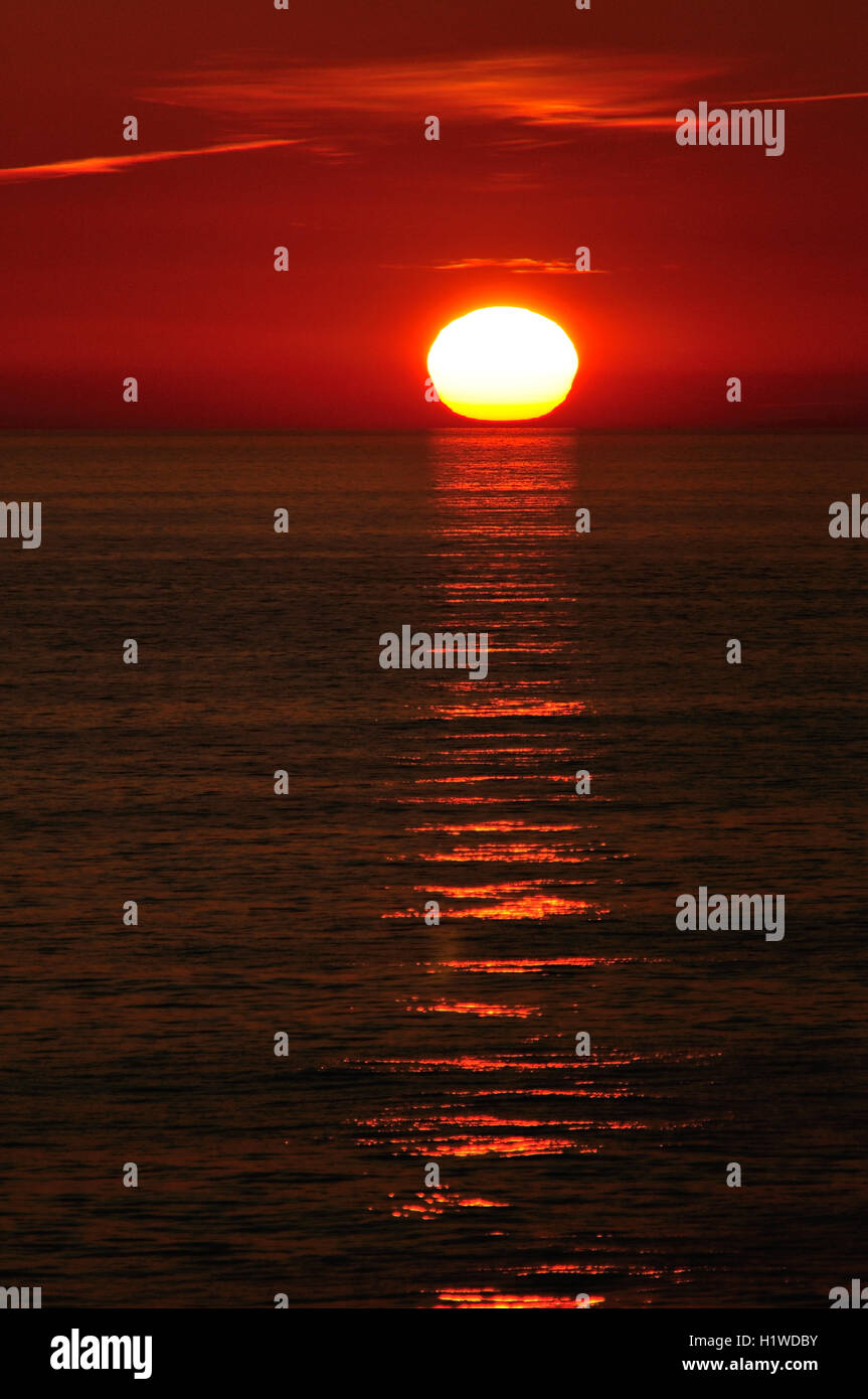 Sunset over the sea Stock Photo - Alamy