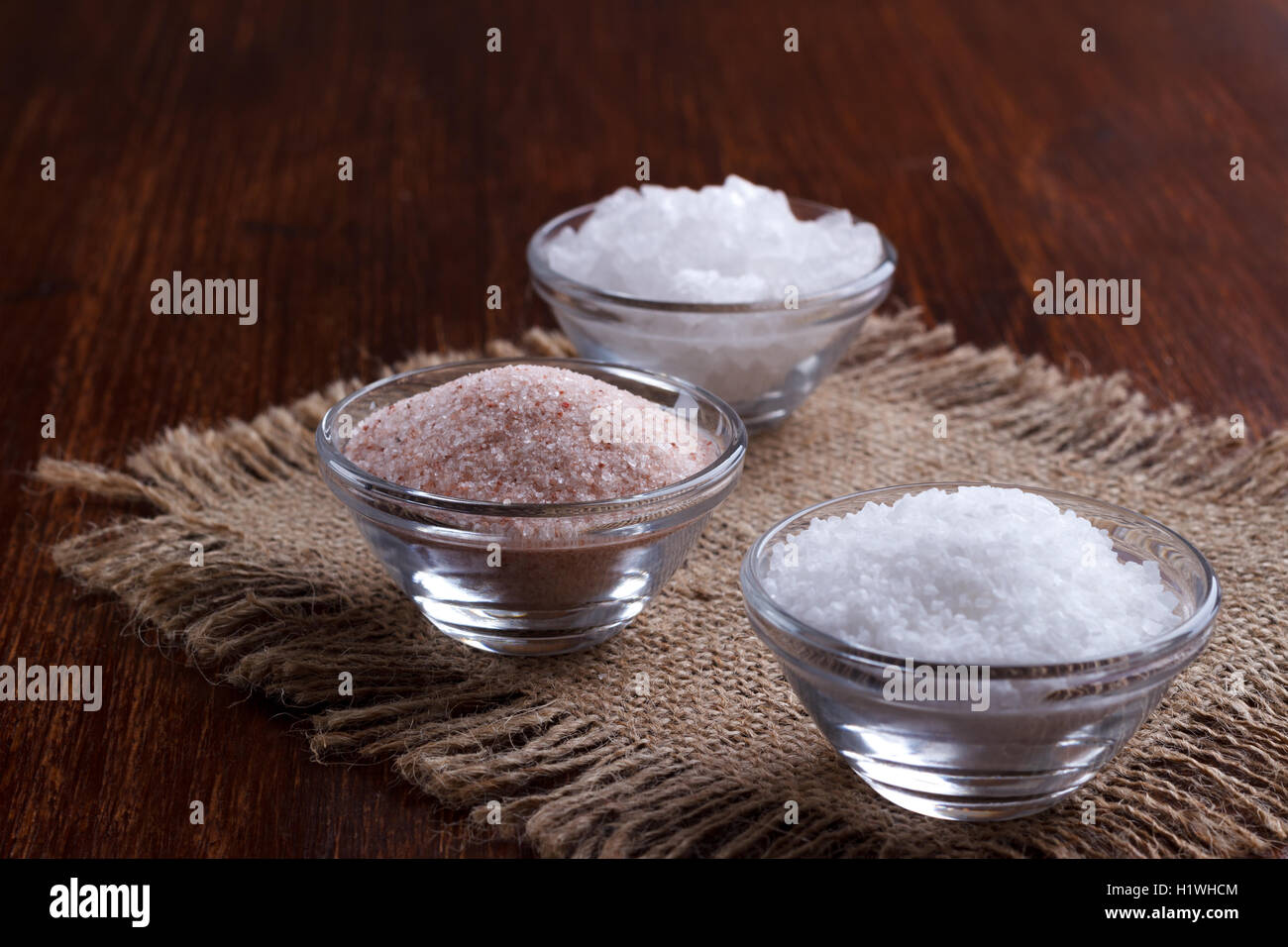 Three types of salt on dark background, selective focus Stock Photo - Alamy
